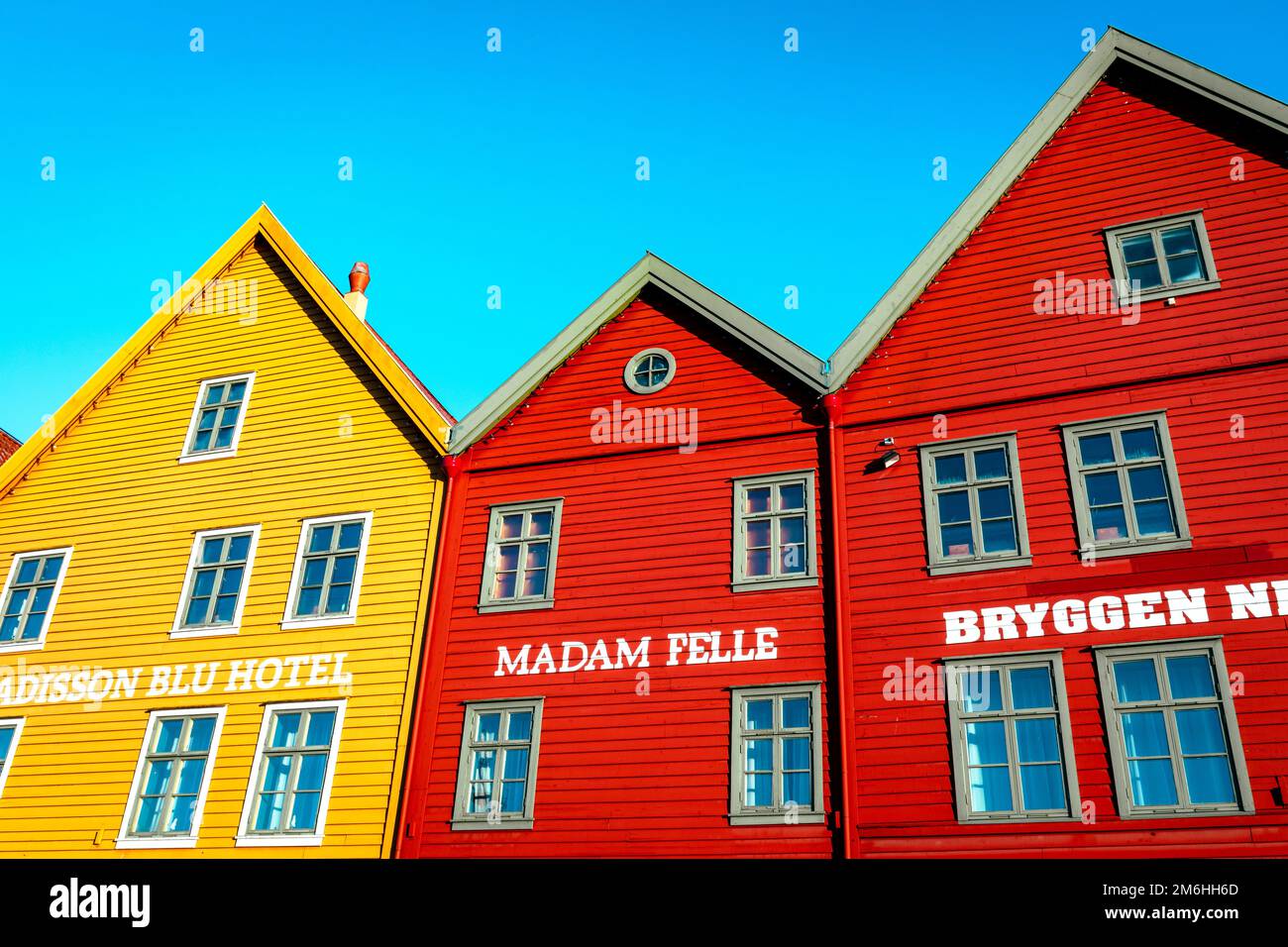 Famous Bryggen street with historical wooden colored houses. Hanseatic ...
