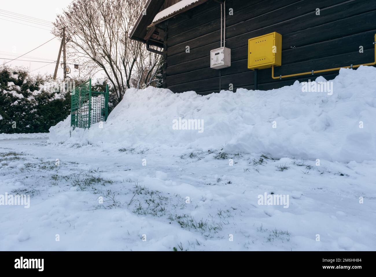 Gas and electricity box on a wooden house among the snow Stock Photo ...