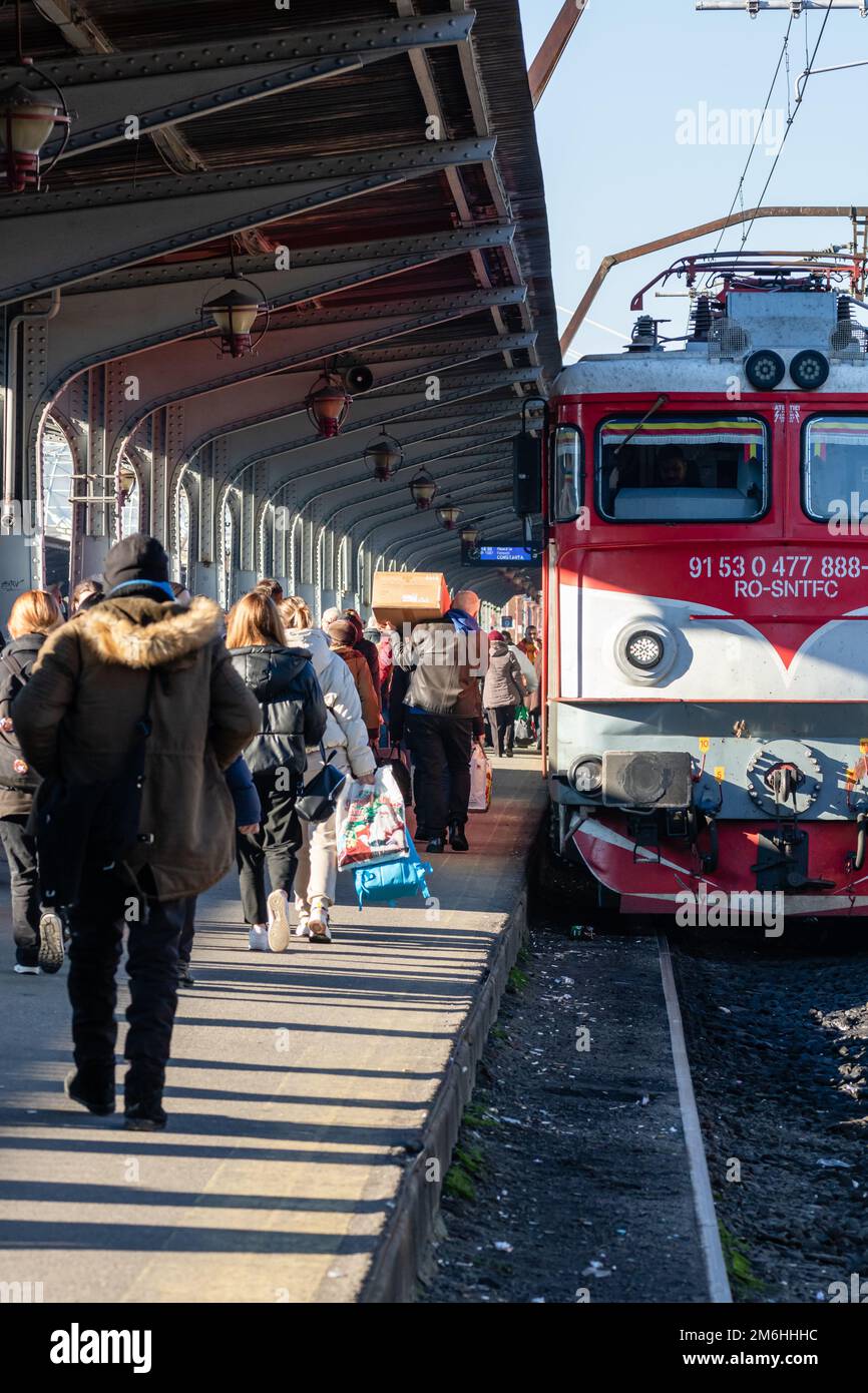 People getting on and off the train at Bucharest North Railway Station ...