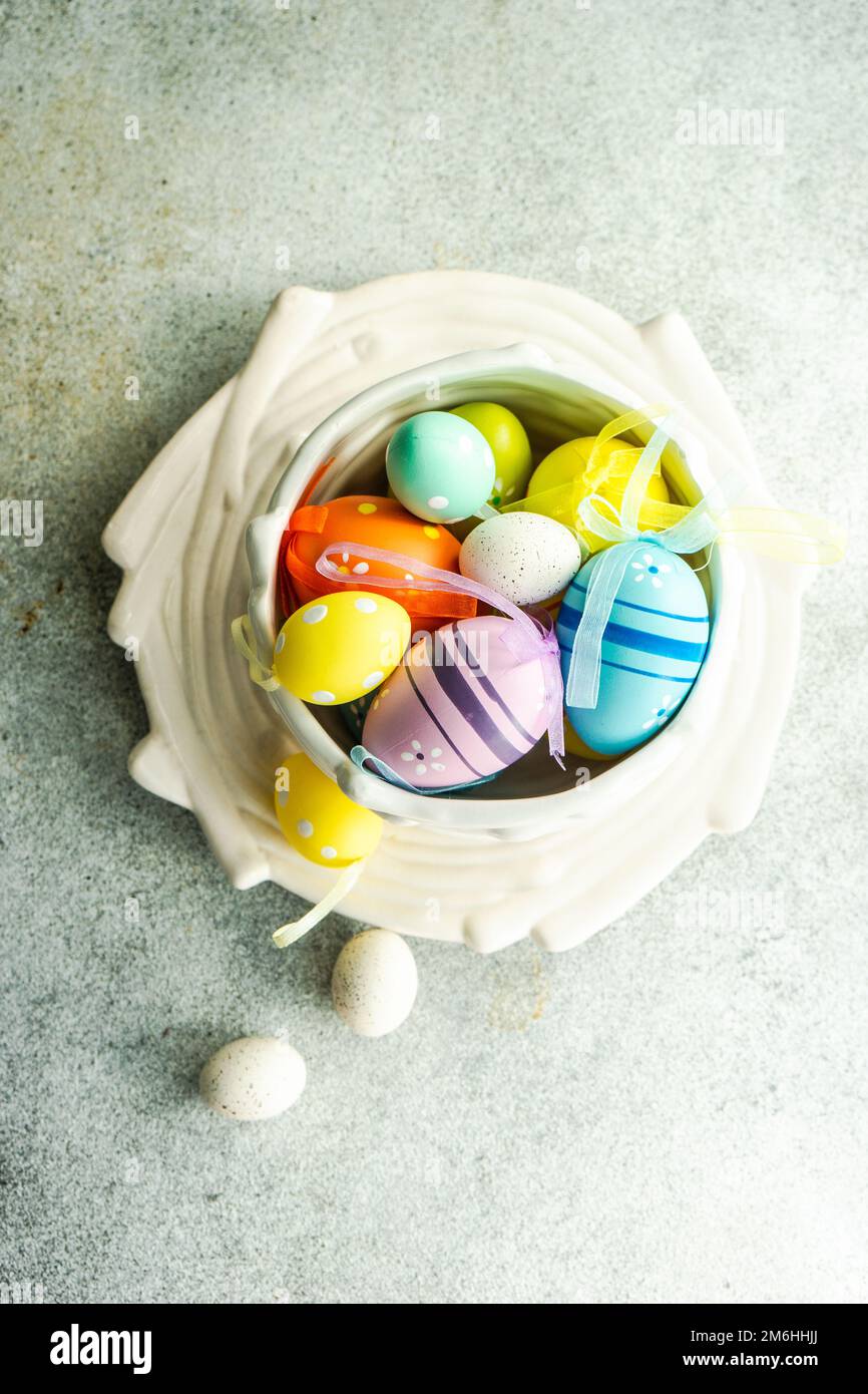 Easter table setting on concrete background Stock Photo - Alamy