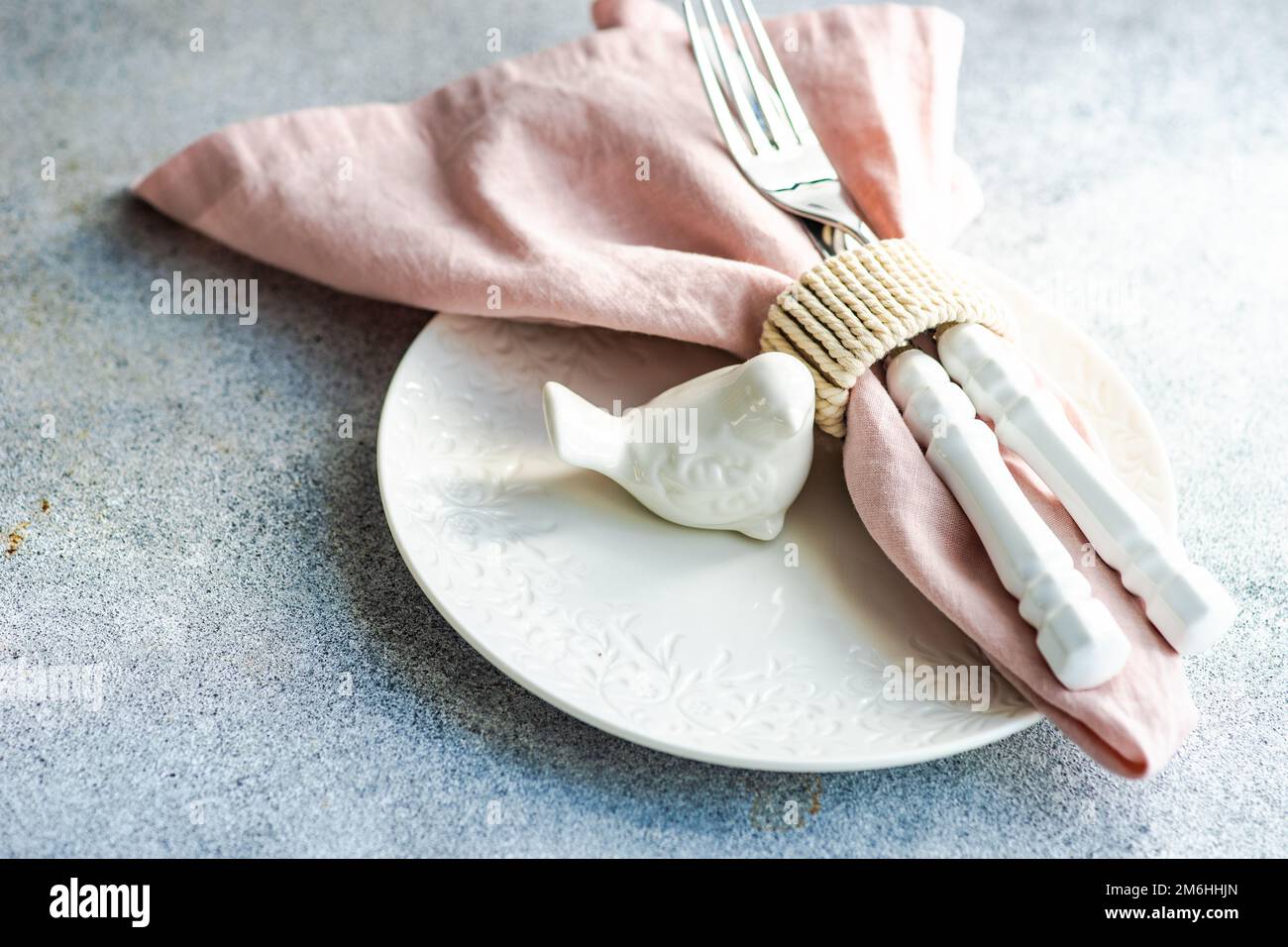 Easter table setting on concrete background Stock Photo - Alamy