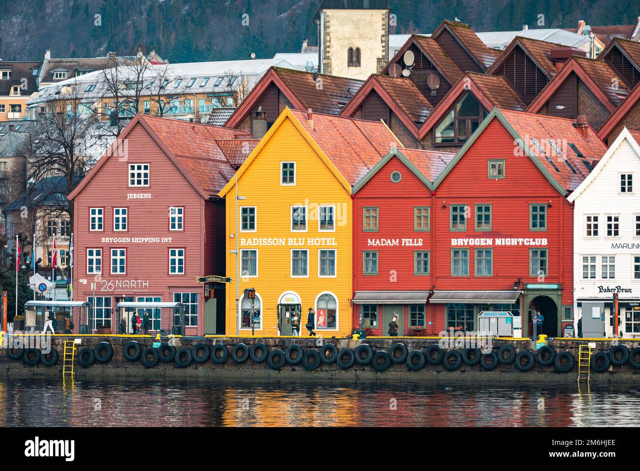 Famous Bryggen street with historical wooden colored houses. Hanseatic ...