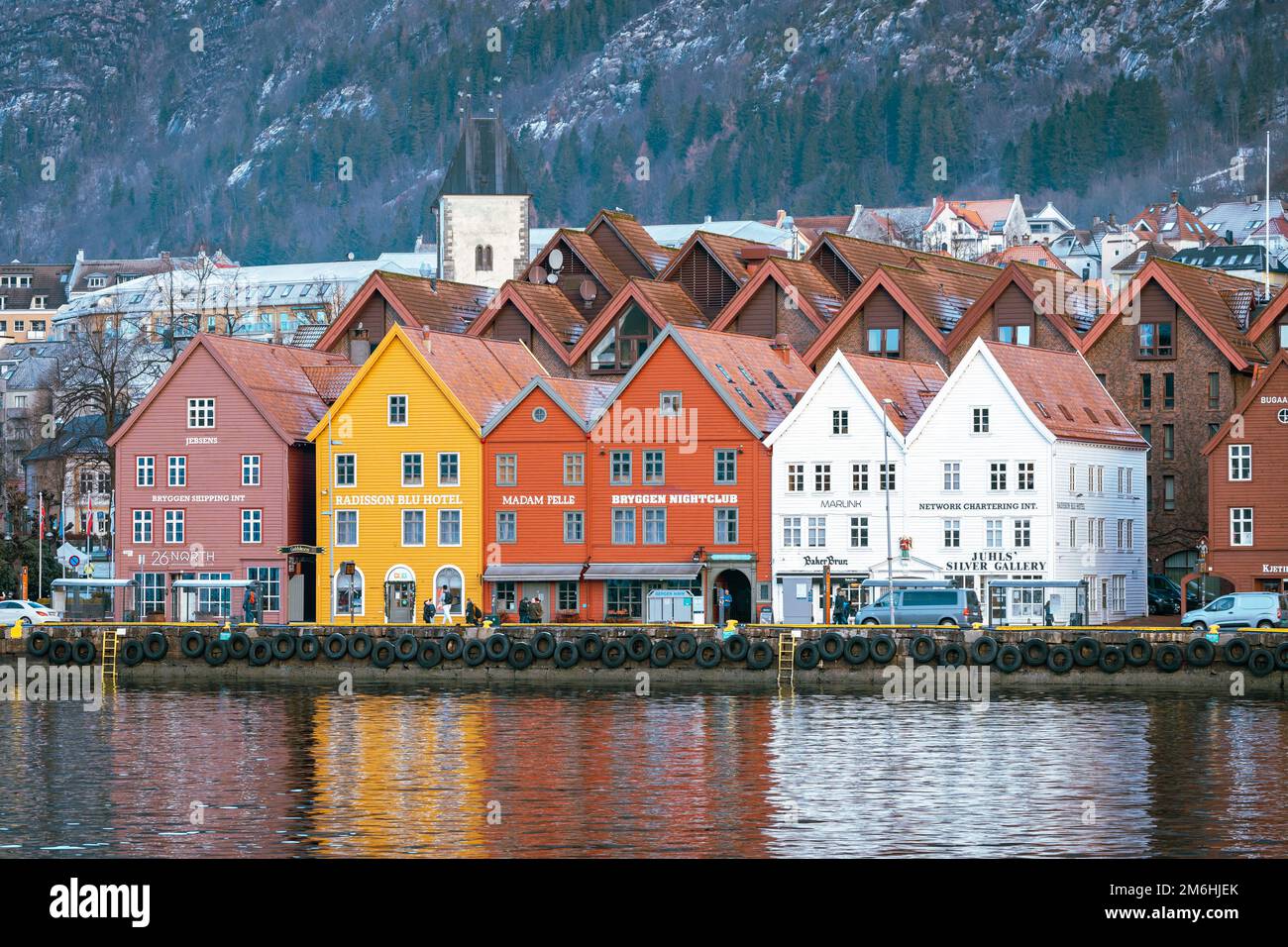 Famous Bryggen street with historical wooden colored houses. Hanseatic ...