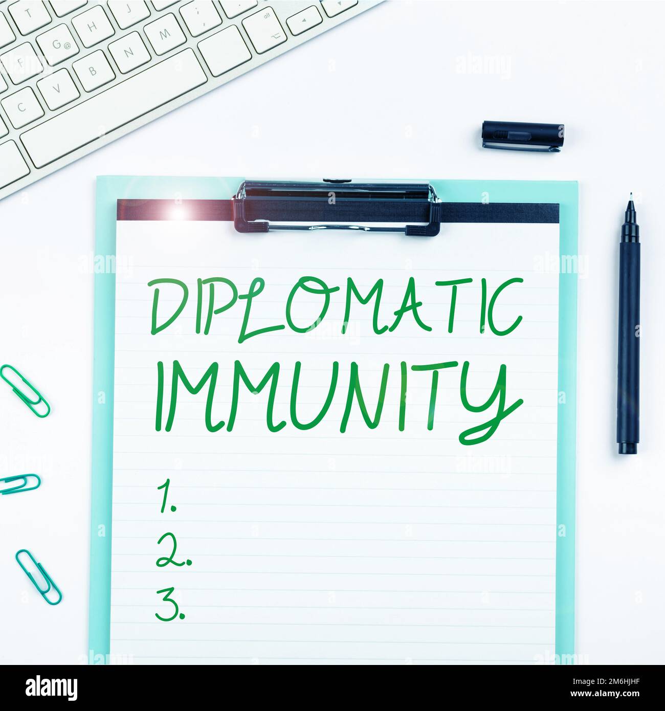 Hand writing sign Diplomatic Immunity. Internet Concept law that gives ...