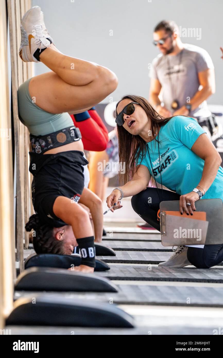 A group of people at an indoor fitness and endurance competition in ...