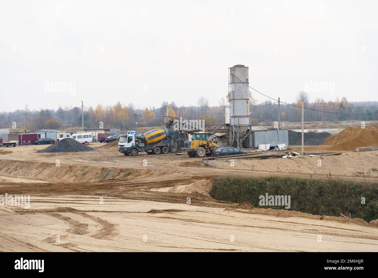 A concrete mixer stands at a modern concrete plant on loading Stock ...