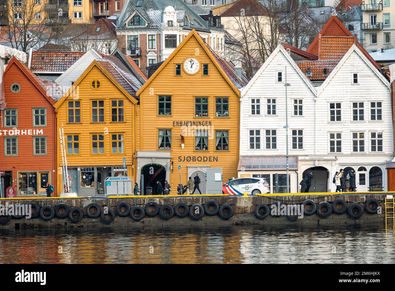 Famous Bryggen street with historical wooden colored houses. Hanseatic ...