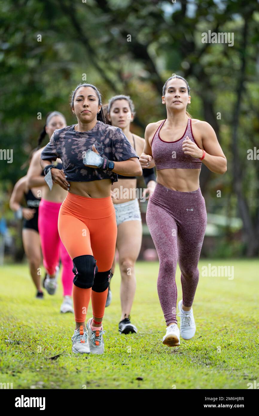A group of people jogging at an outdoor fitness and endurance ...