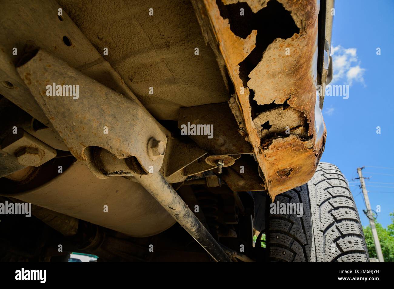 Fragment of a car body with rust. fragment of a rusty wing of a car ...