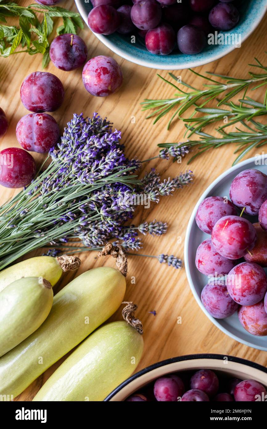 background of fruits, vegetables and herbs. plum, zucchini, lavender ...