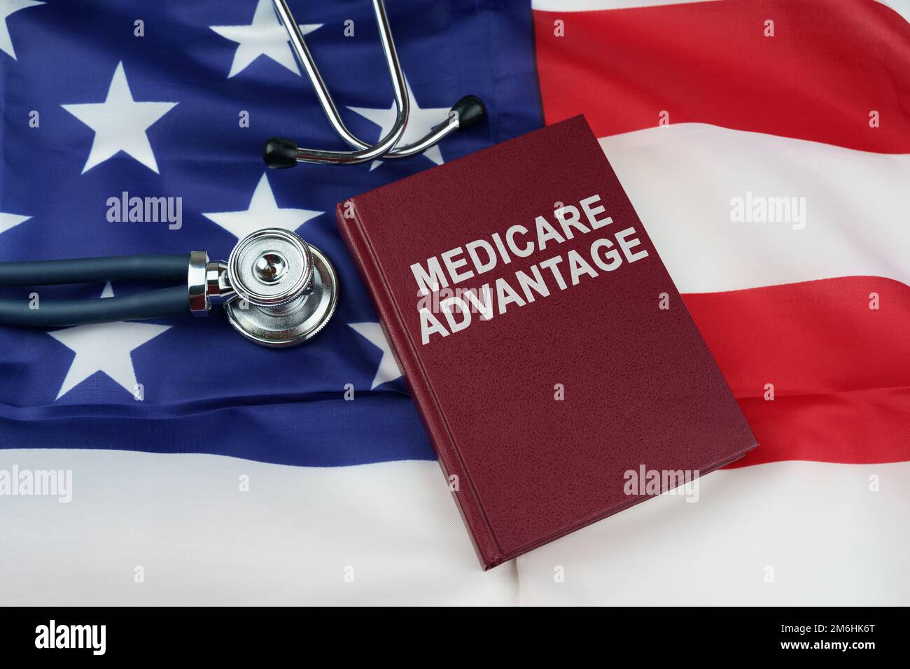 Law concept. On the US flag lies a stethoscope and a book with the ...
