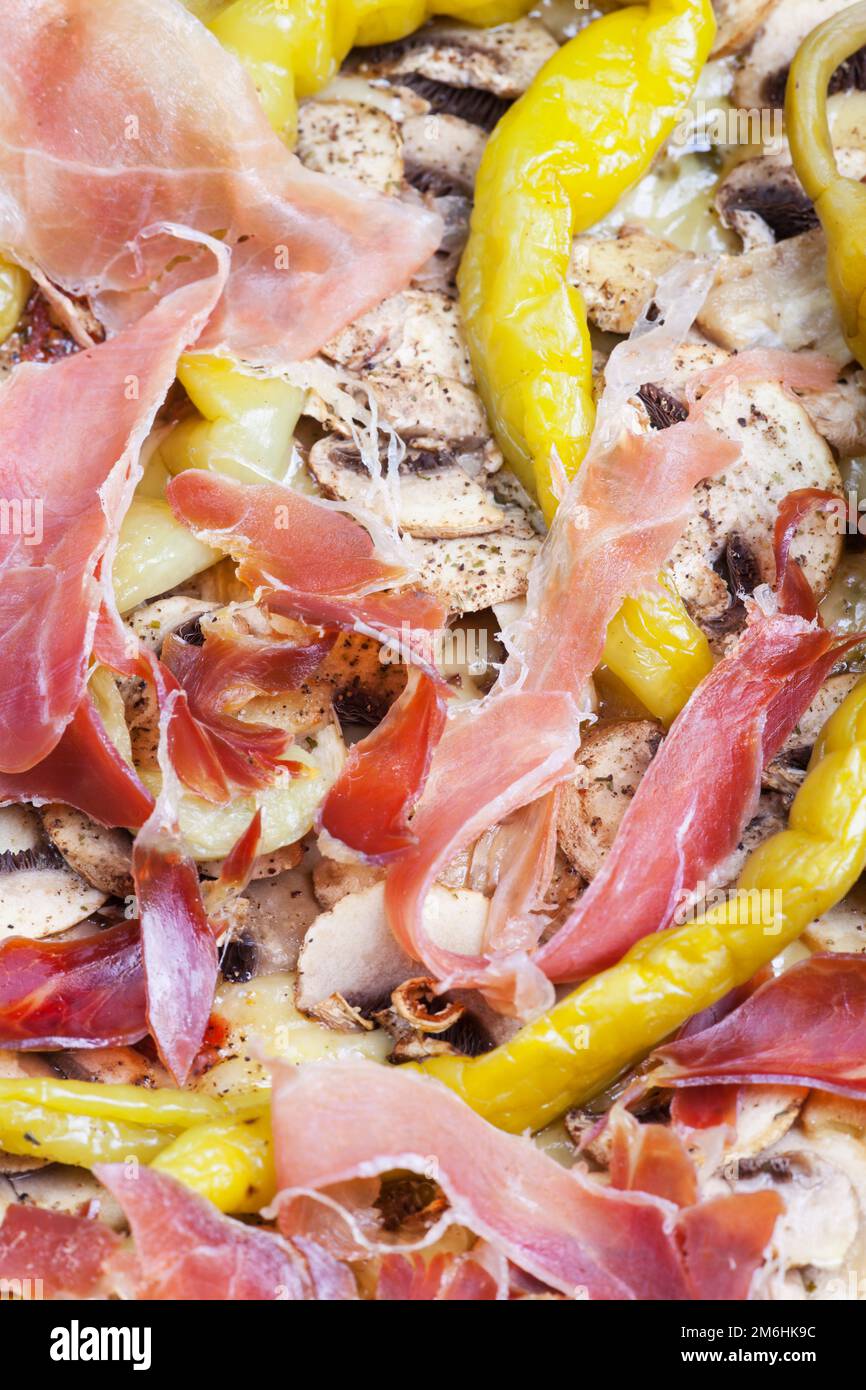 Detail of a pizza with ham Stock Photo - Alamy
