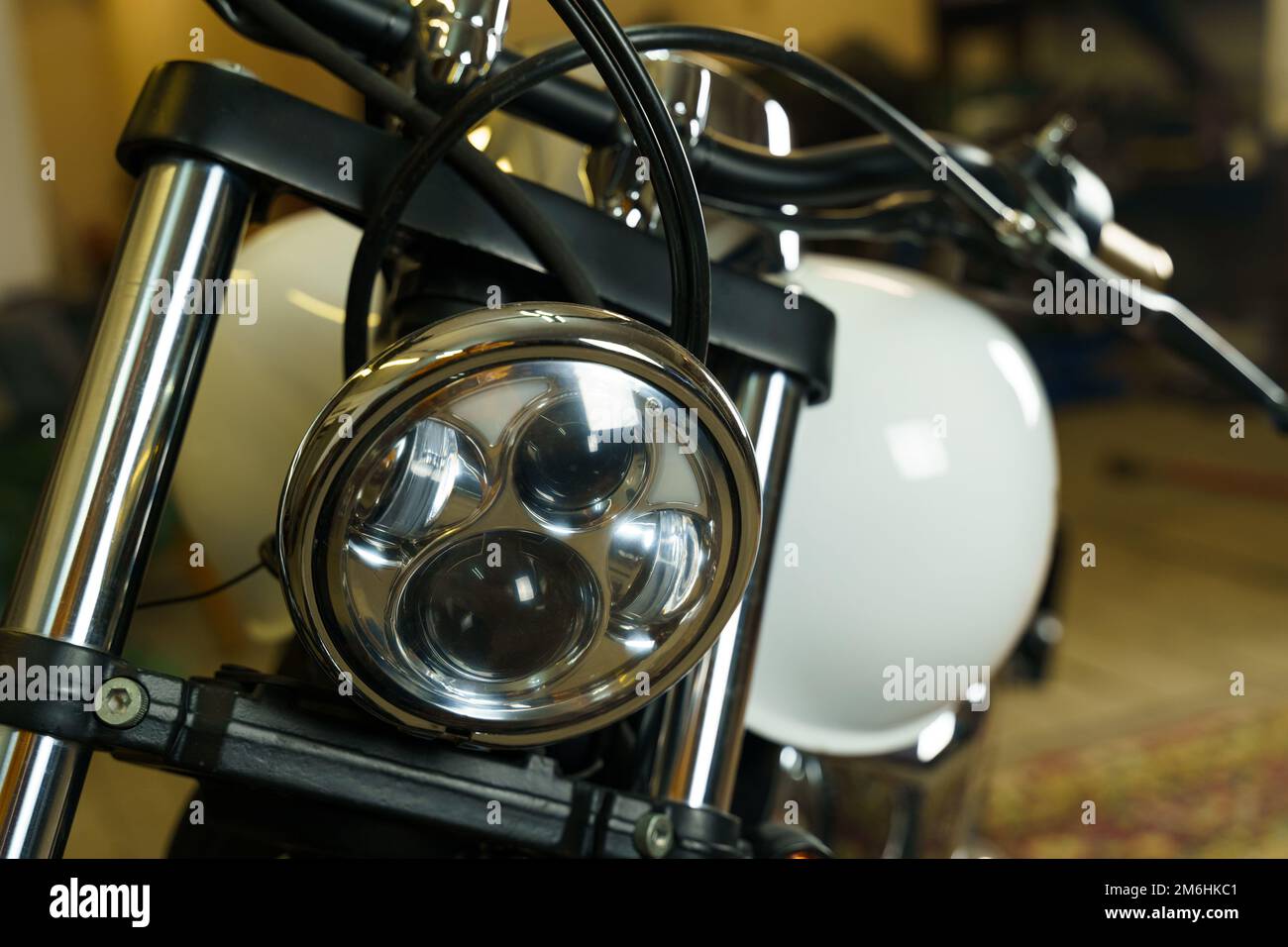 Motorcycle headlights close-up, the motorcycle is in the garage ...