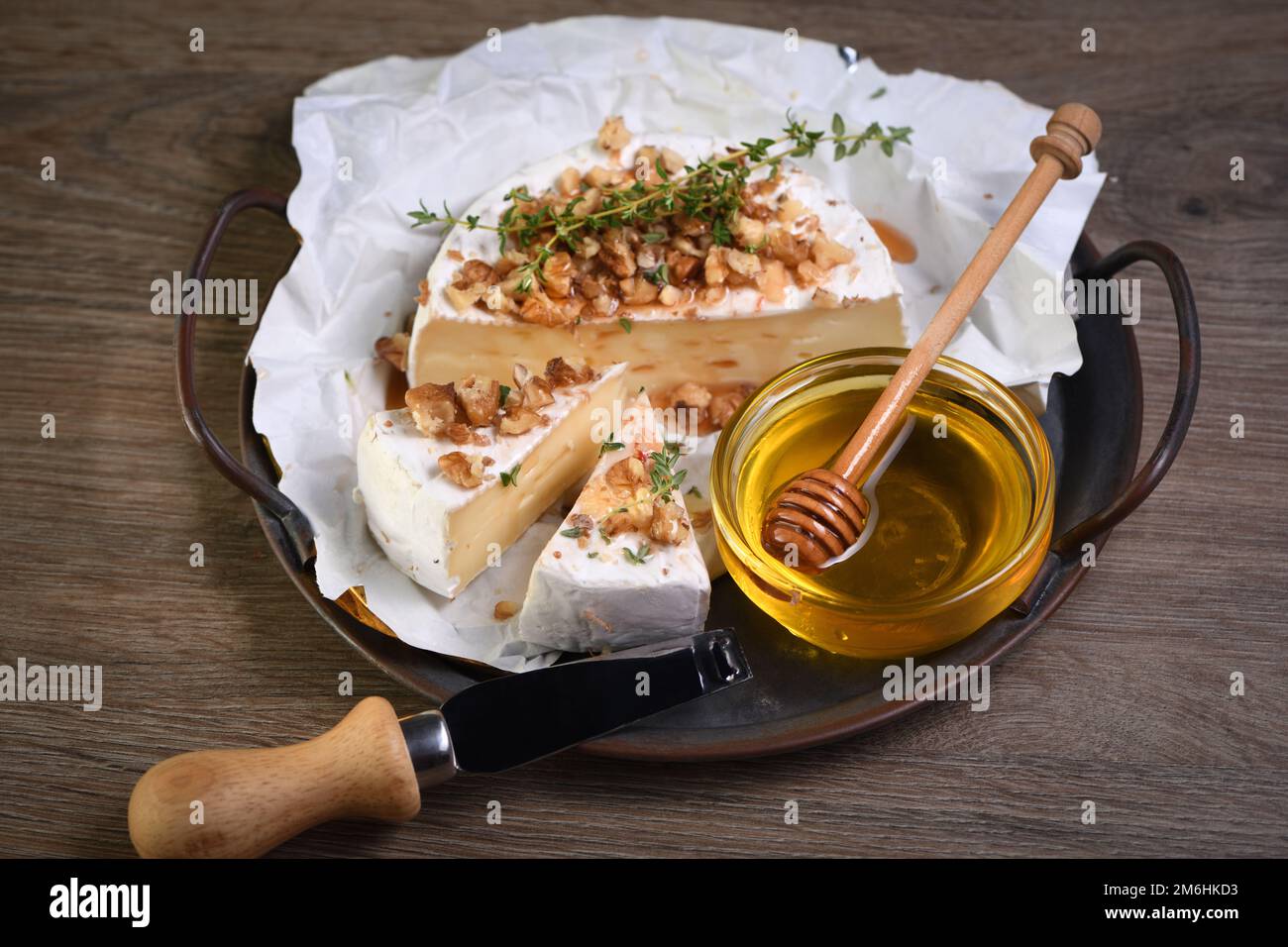 Camembert cheese with honey Stock Photo - Alamy