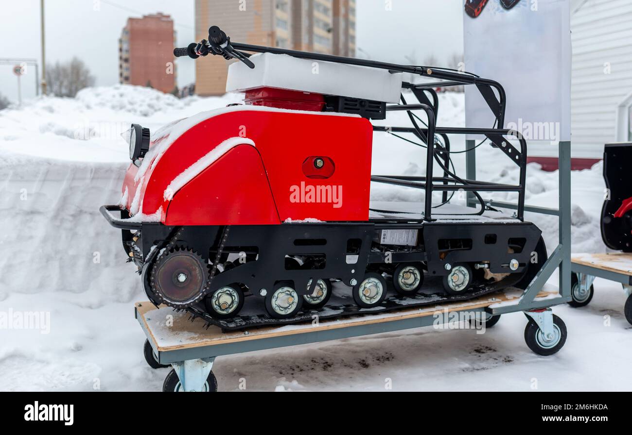 A new petrol snowplow is on sale. Snow removal mechanism Stock Photo ...