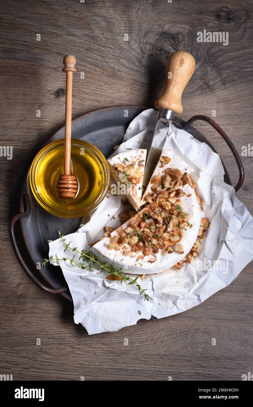 Camembert cheese with honey Stock Photo - Alamy