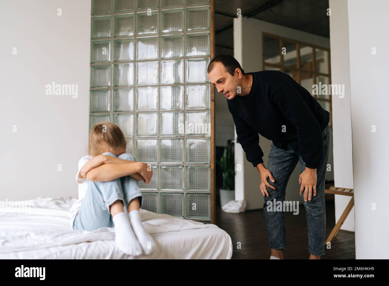 Portrait of angry father scolding, raising voice, shouting at sad ...