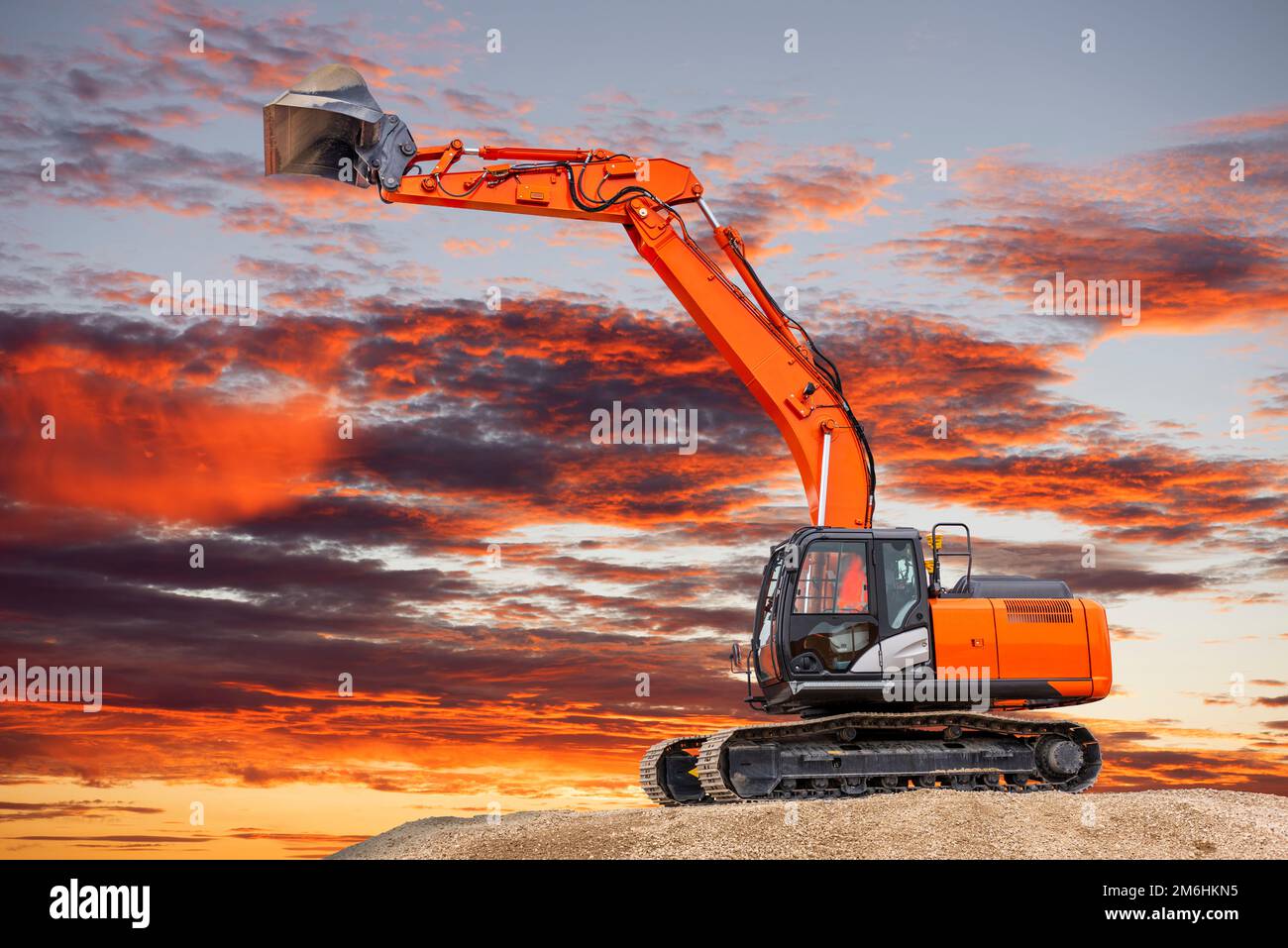 Excavator on construction site and truck at work Stock Photo - Alamy