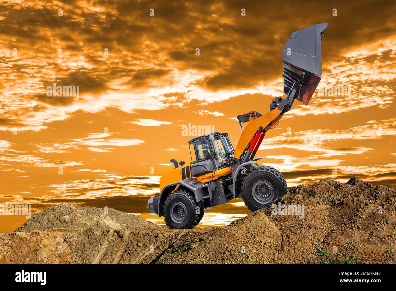 Excavator on construction site and truck at work Stock Photo - Alamy