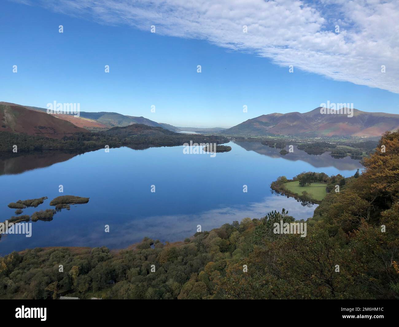 A landscape of Surprise View lake with trees with blue cloudy sky in ...