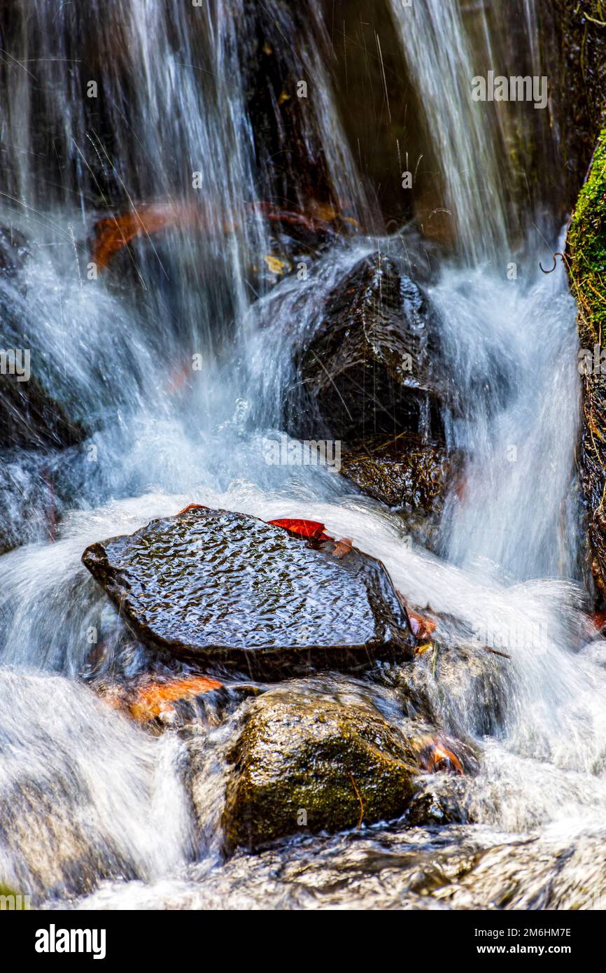 Small waterfall water splashing Stock Photo - Alamy