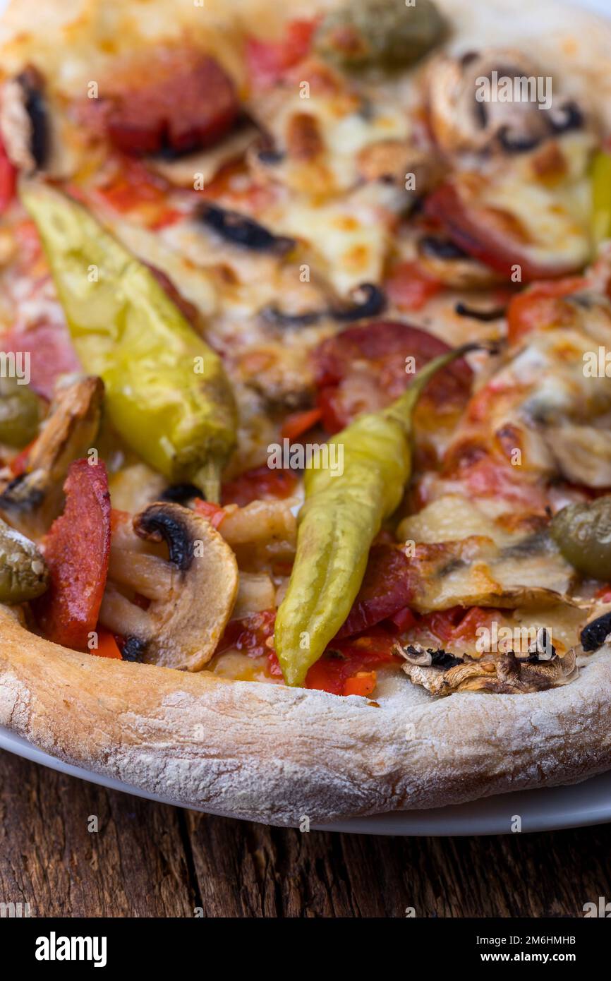 Close up of a pizza on a plate Stock Photo - Alamy
