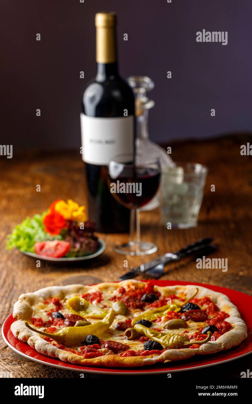 Fresh pizza with red wine Stock Photo - Alamy