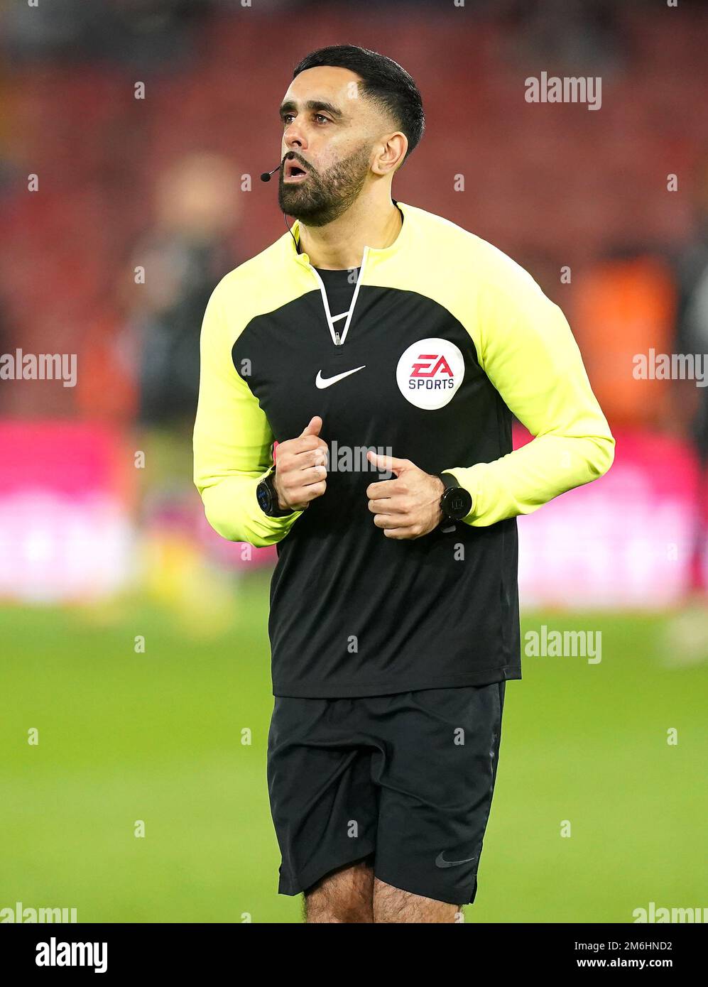 Assistant referee Bhupinder Singh Gill warming up prior to kick-off in ...