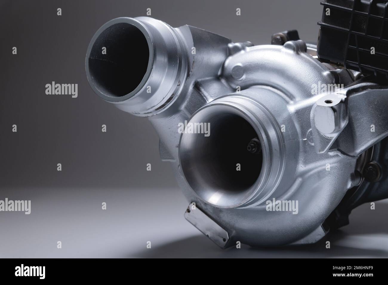 New car turbine on a gray background. Blower for air intake system ...