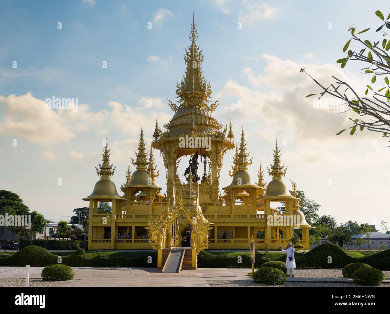 Golden temple at sunset. Buddhist temple inside Wat Rong Khun (White ...