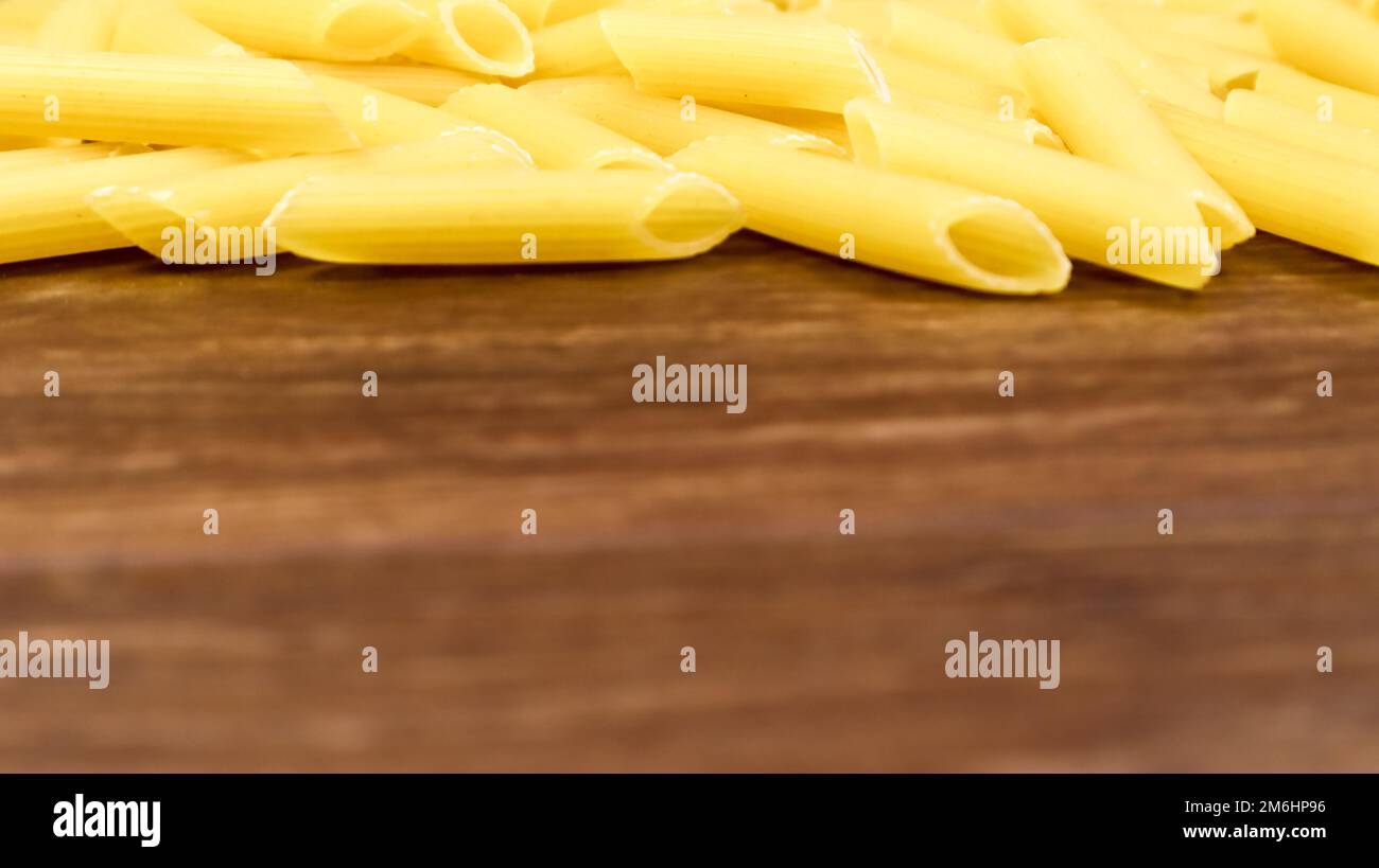 Penne Rigate Raw Pasta is a short pasta with oblique cuts and a ribbed ...