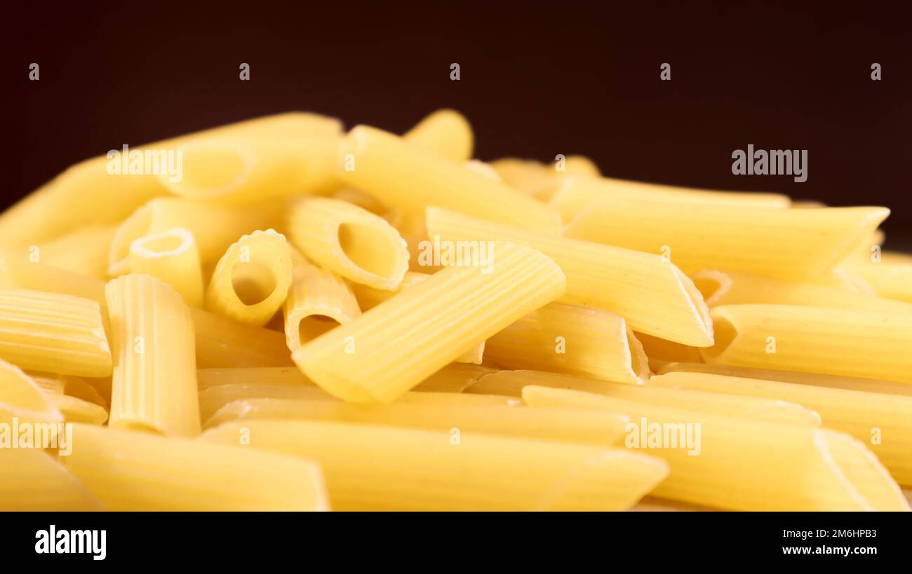 Penne Rigate Raw Pasta is a short pasta with oblique cuts and a ribbed ...