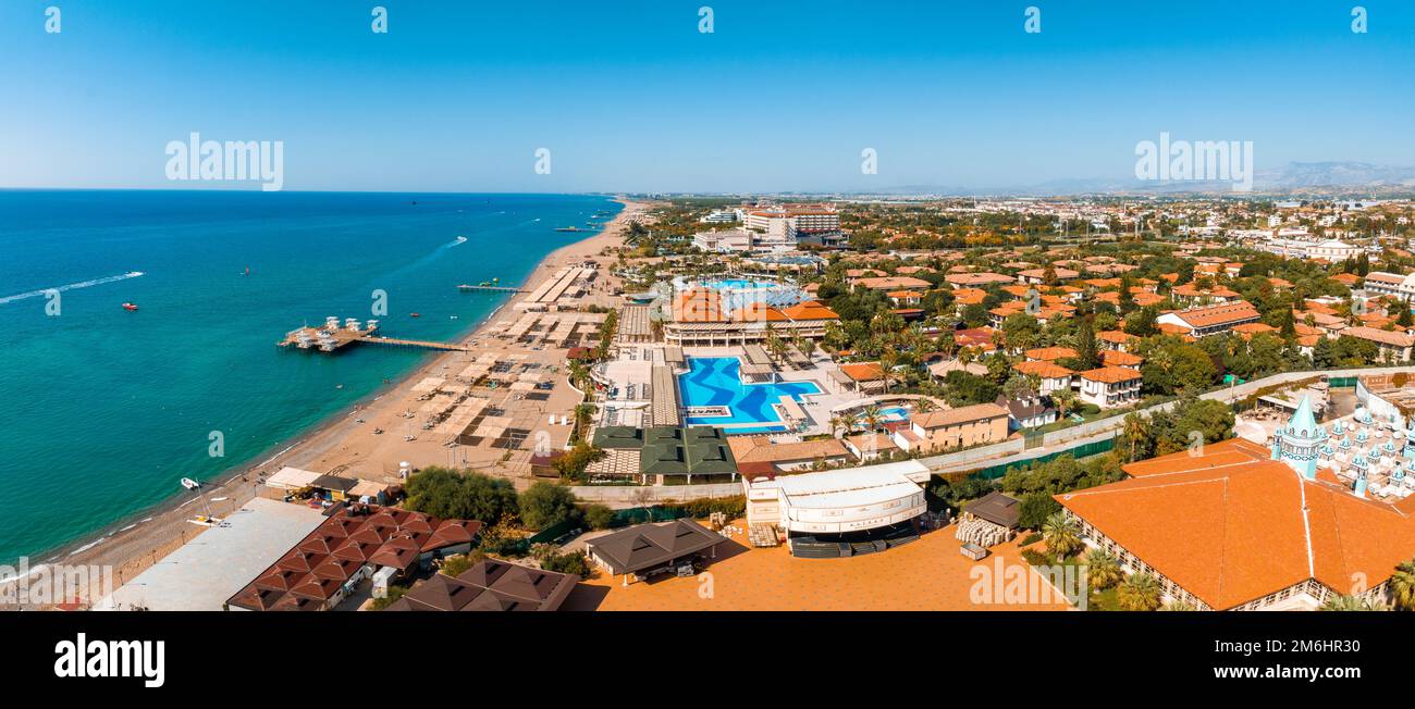 ropical landscape with palm trees, parasols, white sand, ocean Stock ...