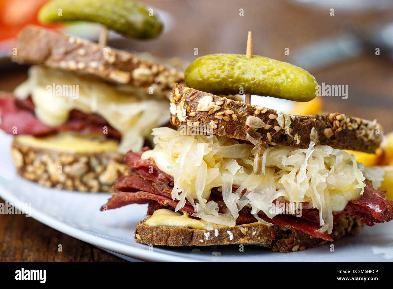Reuben Sandwich on rustic wood Stock Photo - Alamy