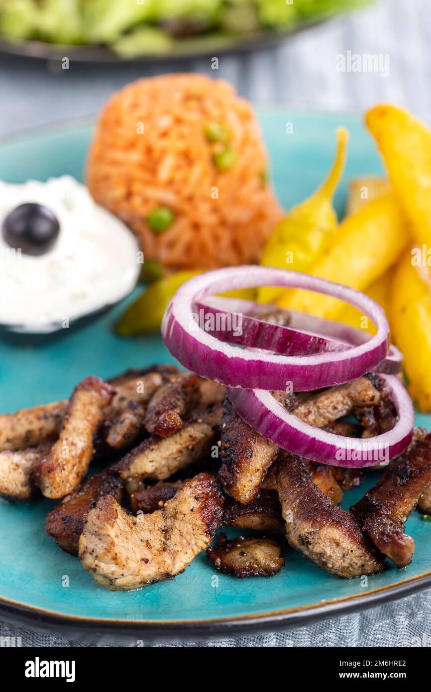 Greek gyros on a plate with french fries Stock Photo - Alamy