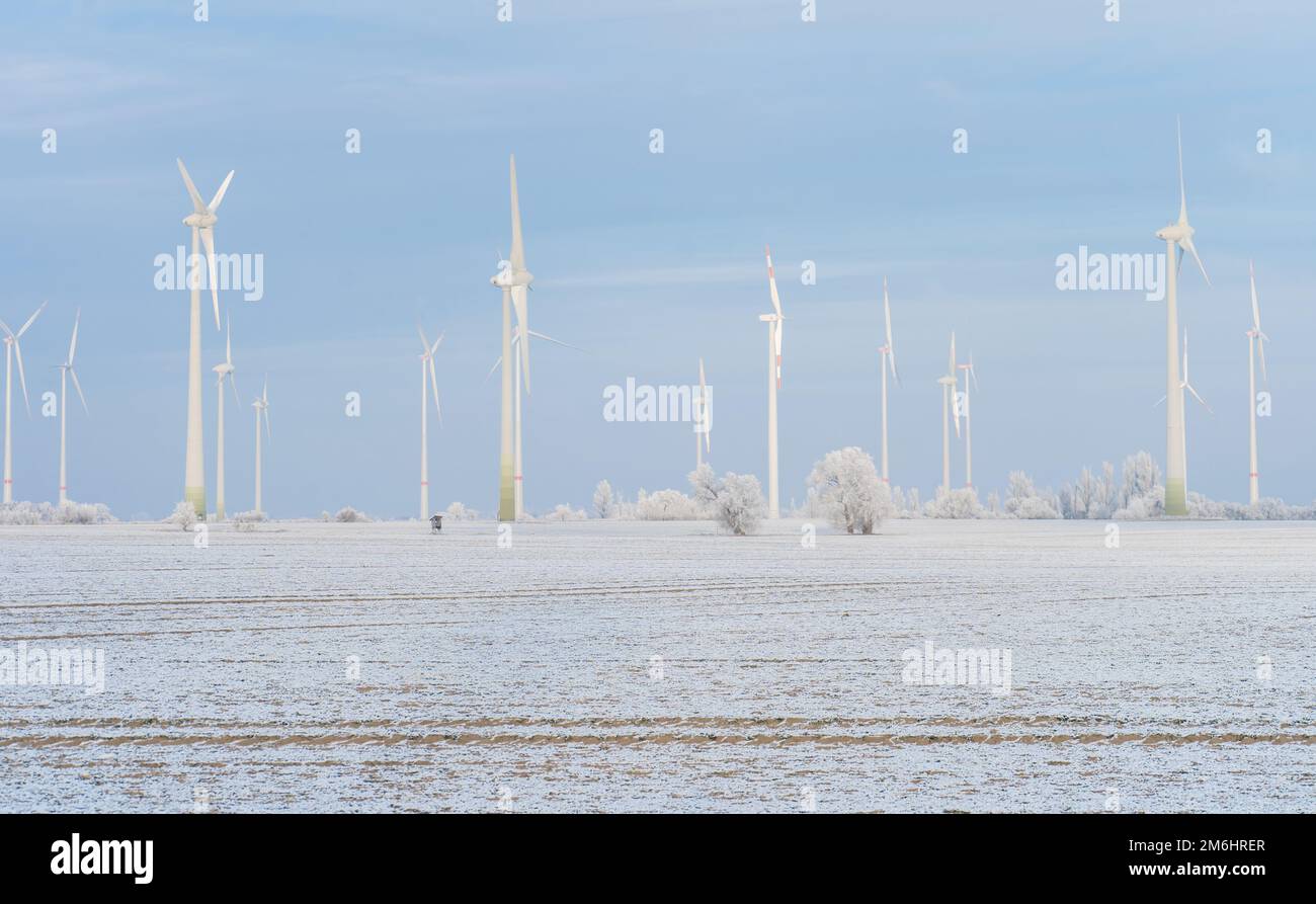 Field with wind turbines in winter Stock Photo - Alamy
