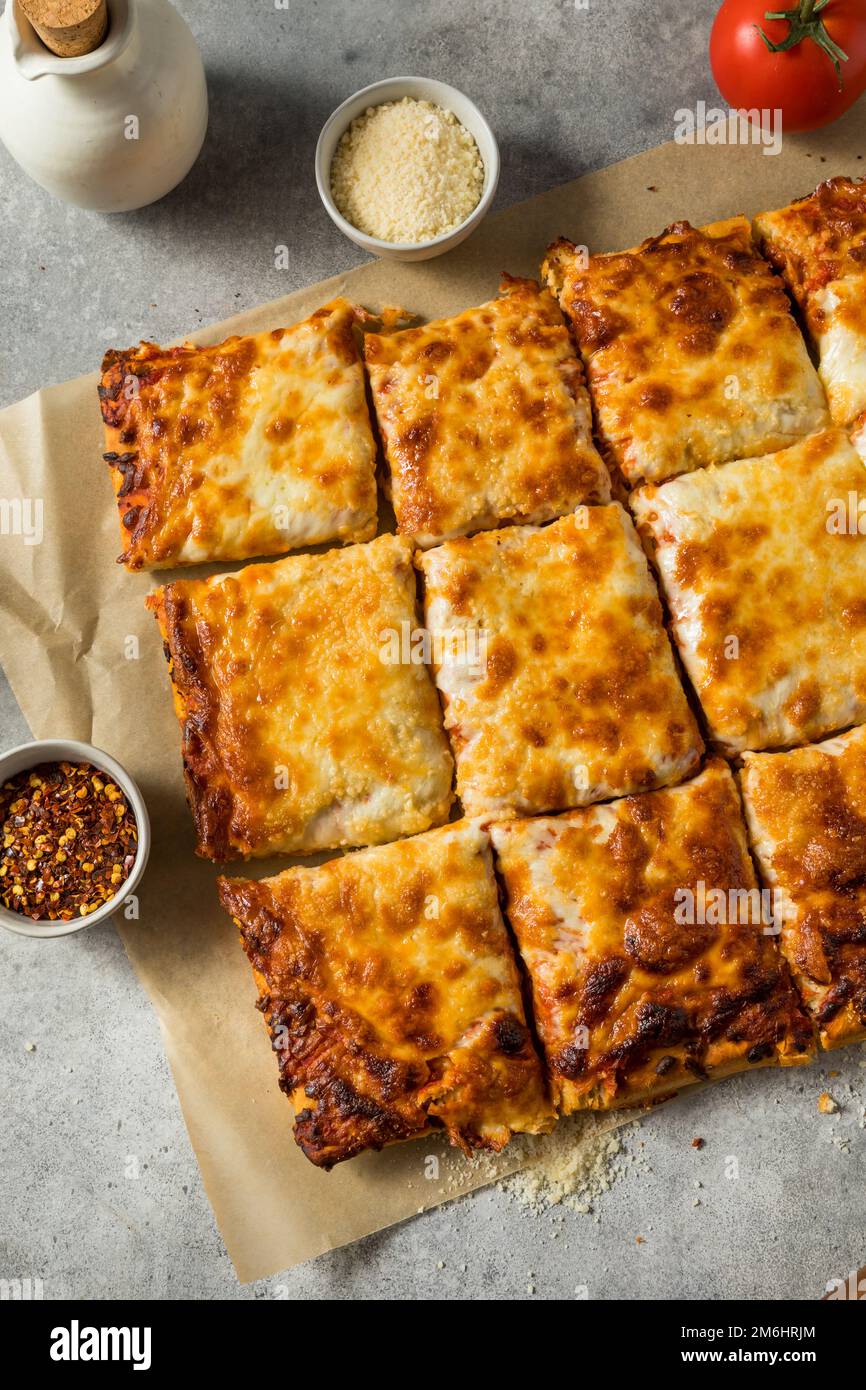 Homemade Grandma Cheese Pizza Pie with Tomato Sauce Stock Photo - Alamy
