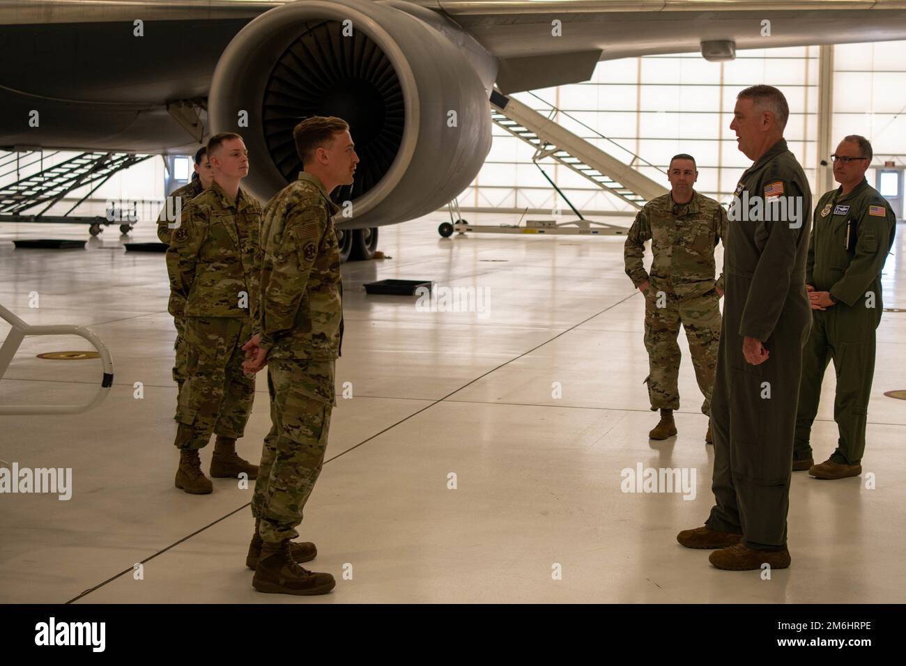 General Mike Minihan, Commander of Air Mobility Command, tours a hangar ...