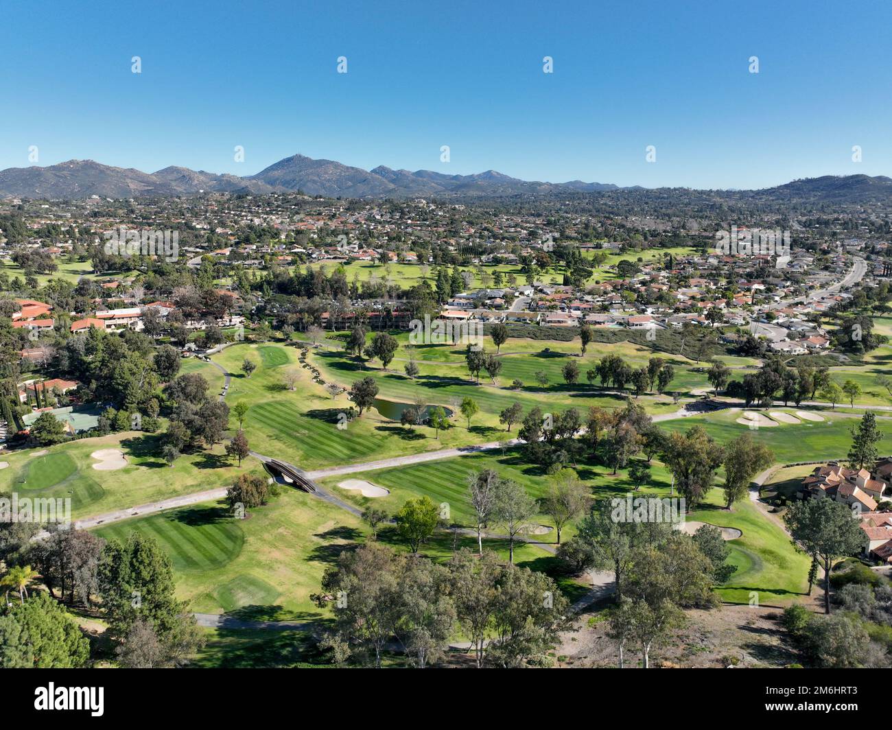 Aerial view of green golf in upscale residential neighborhood in South ...