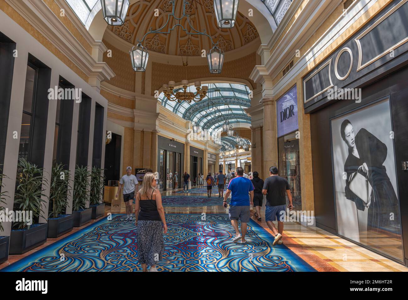 Beautiful view of tourists walking through shopping area of hotel. Las ...