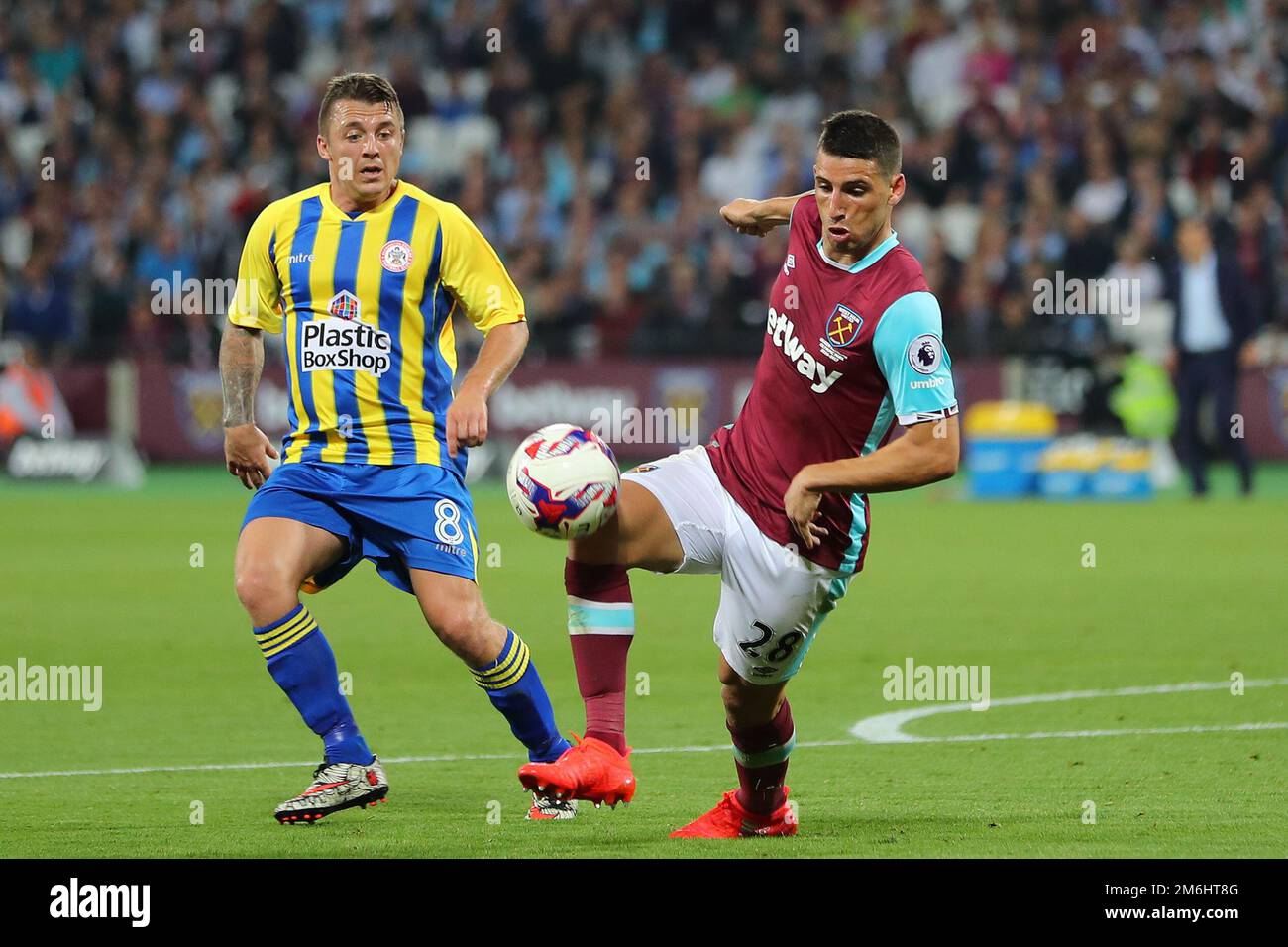 Jonathan Calleri of West Ham United gets away from Scott Brown of ...