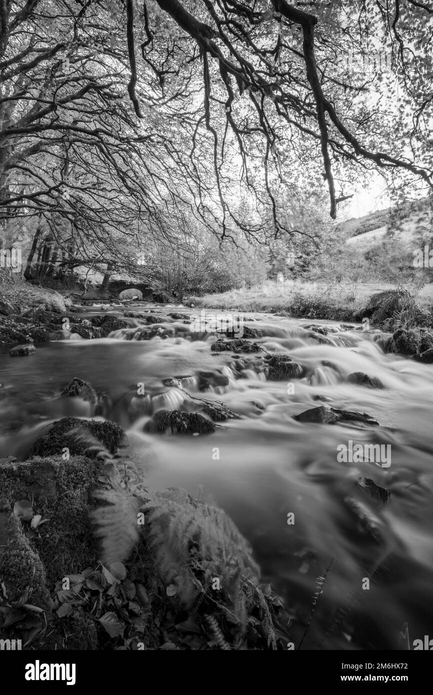 The Weir Water river flowing under Robbers Bridge in Exmoor National ...