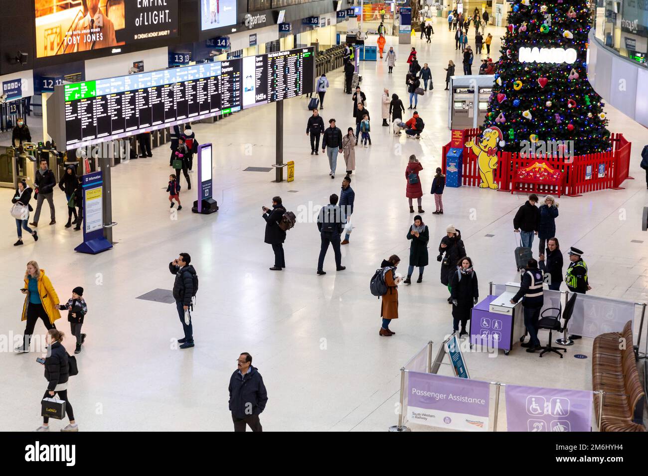 London, UK. 3rd Jan, 2023. Travelers look at the information board as ...