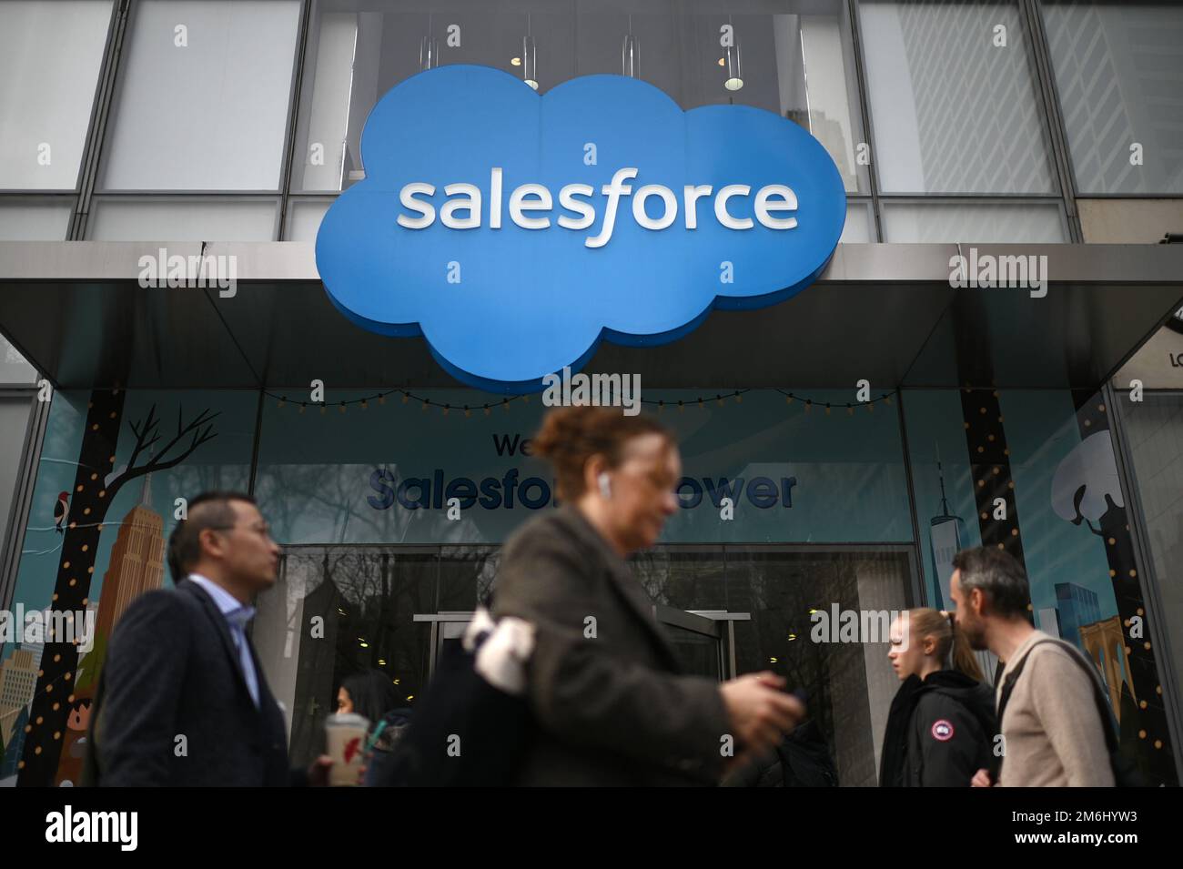 Pedestrians walk past the Salesforce Inc. office tower building, as the ...