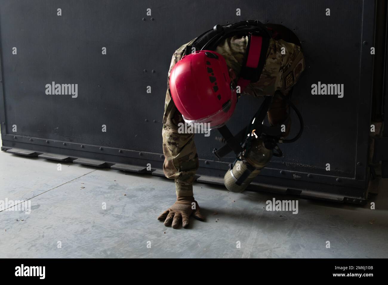 U.S. Air Force Airman 1st Class Jonathan Laguerta crawls through a hole ...