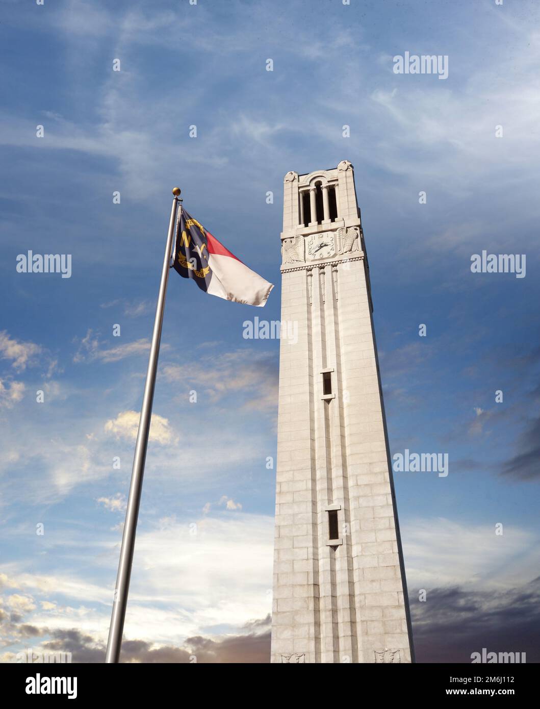 The bell tower and NC state flag on the campus of NC State University ...