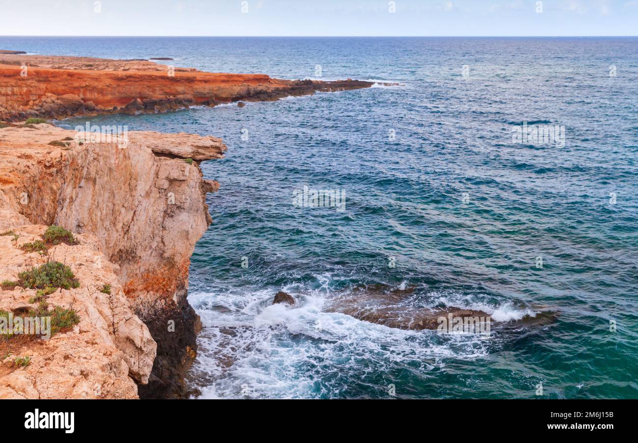 Landscape photo with coastal rocks and shore waves. Mediterranean Sea ...