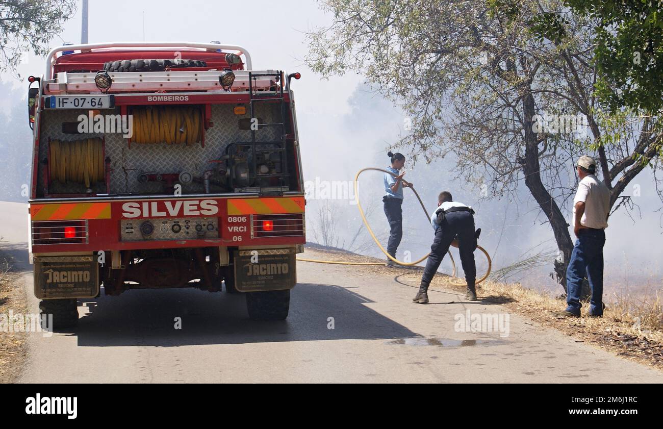 Brave firefighters fight the flames in the Algarve - Portugal Stock ...