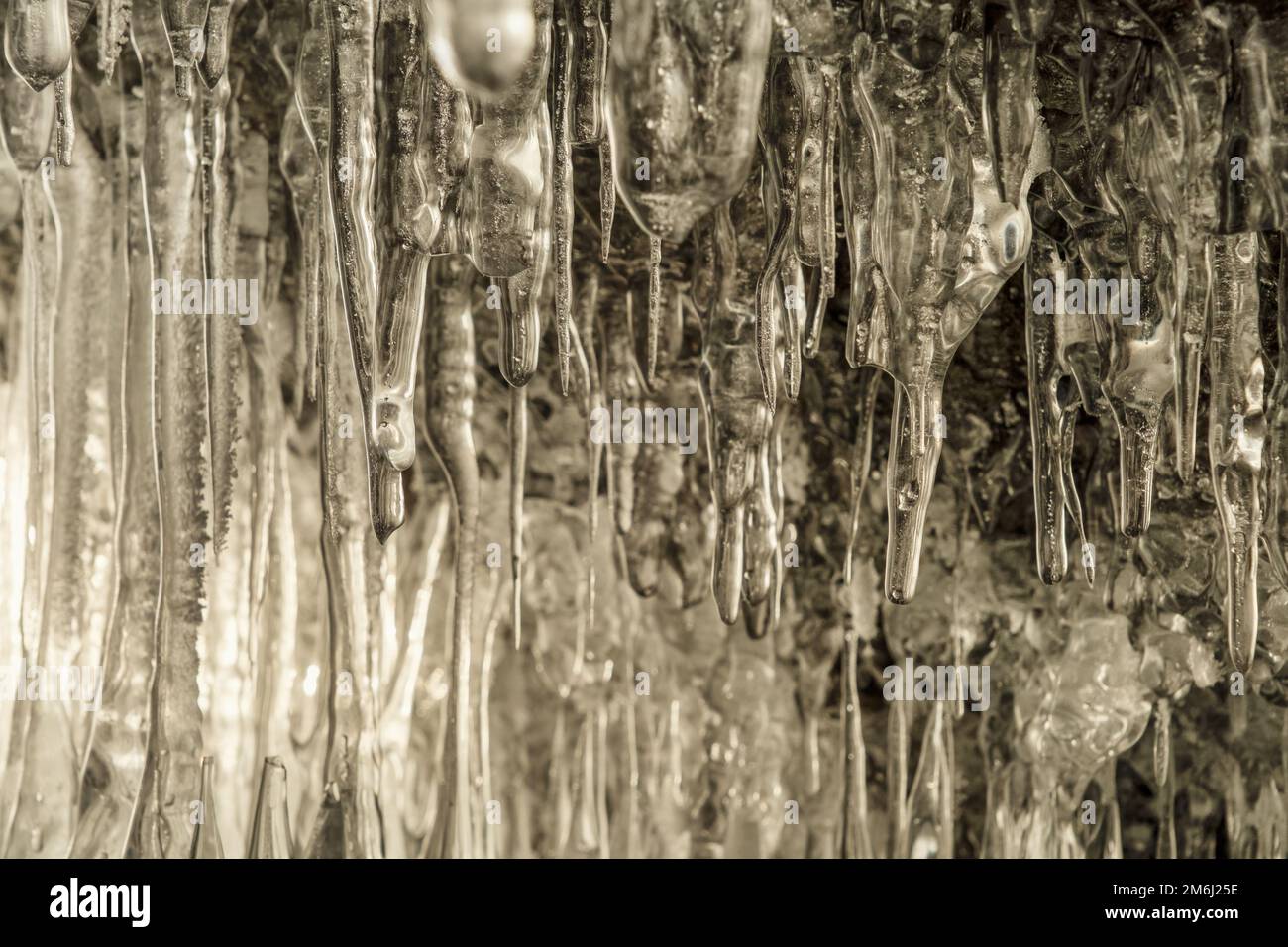 Clear ice and icicles in grotto Stock Photo - Alamy