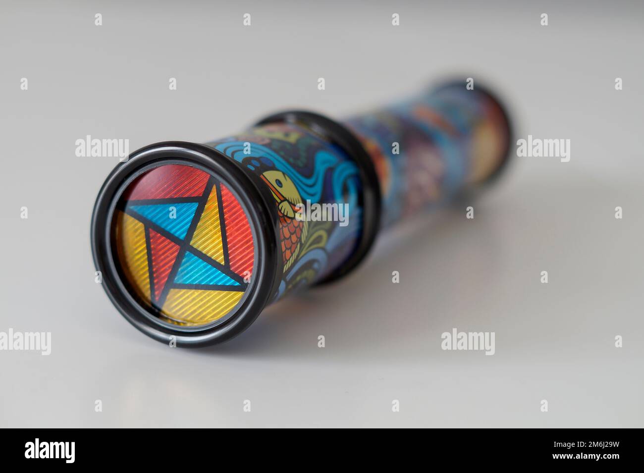 Close-up of a kid's kaleidoscope toy used to create abstract images ...